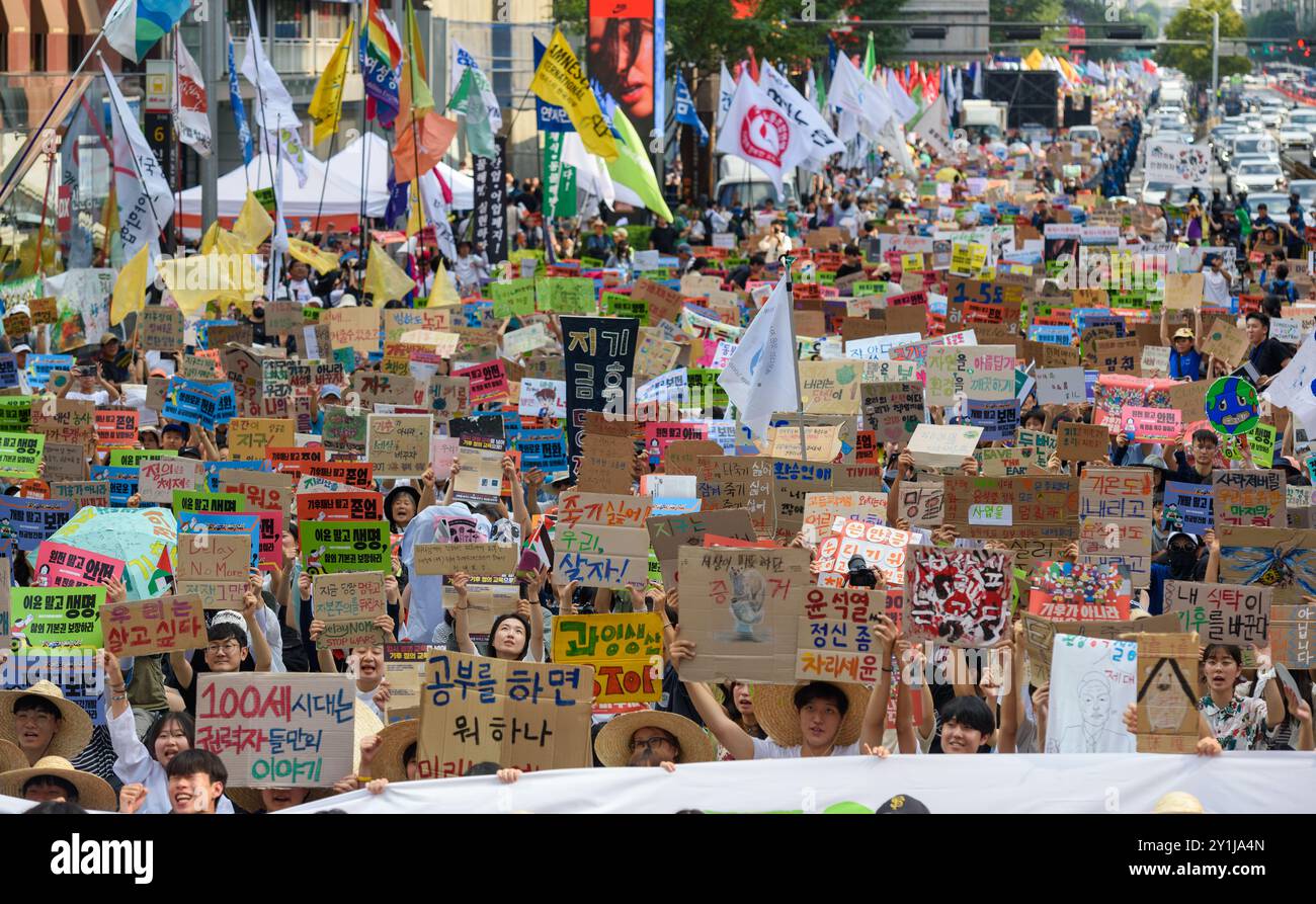 South Korean environmental activists hold placards during a climate ...