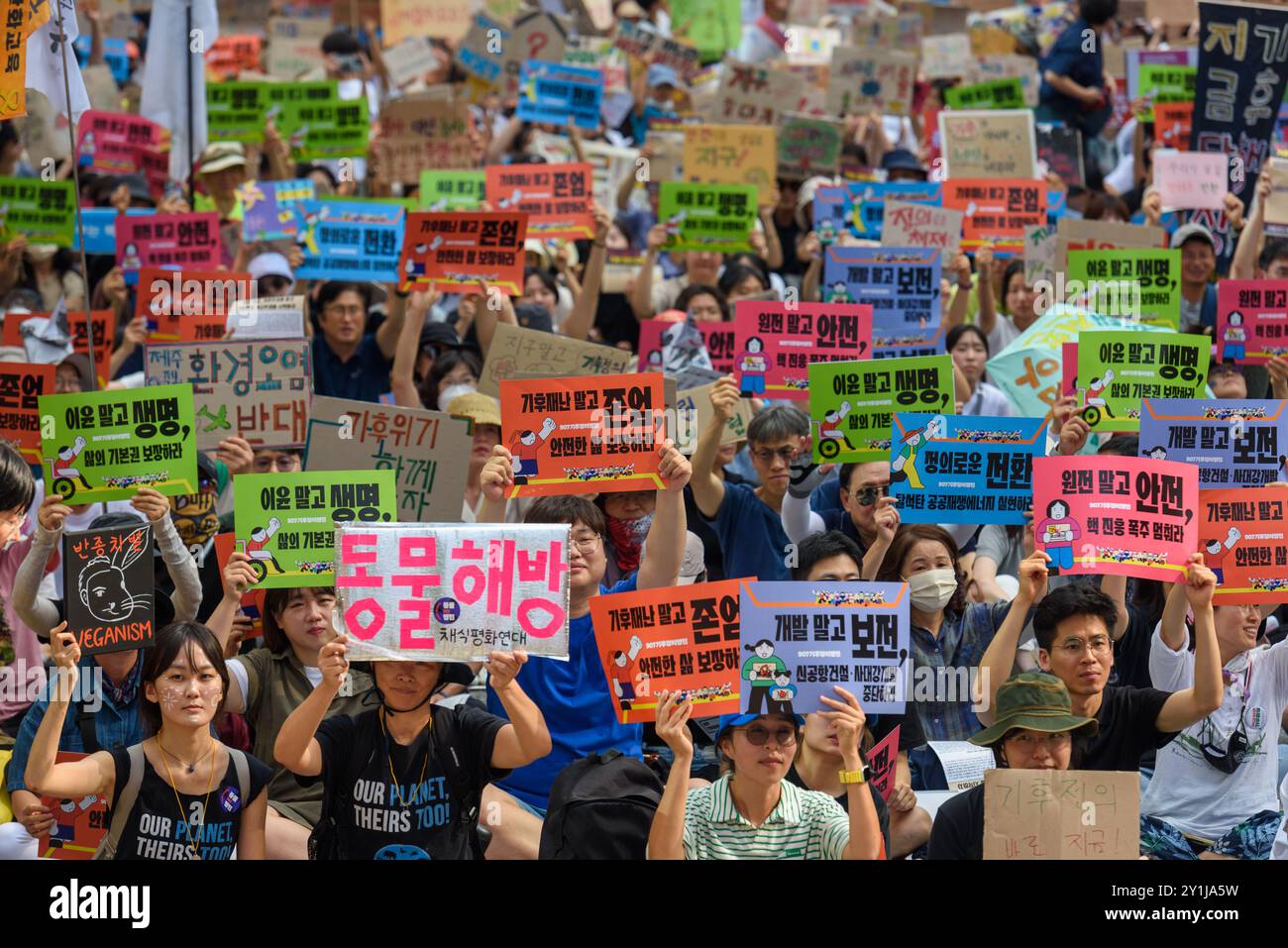 South Korean environmental activists hold placards during a climate ...