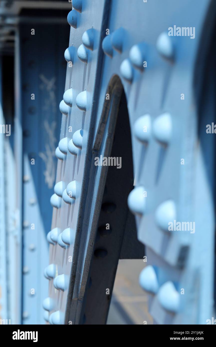 Steel bridge structure joined with blue rivets Stock Photo - Alamy