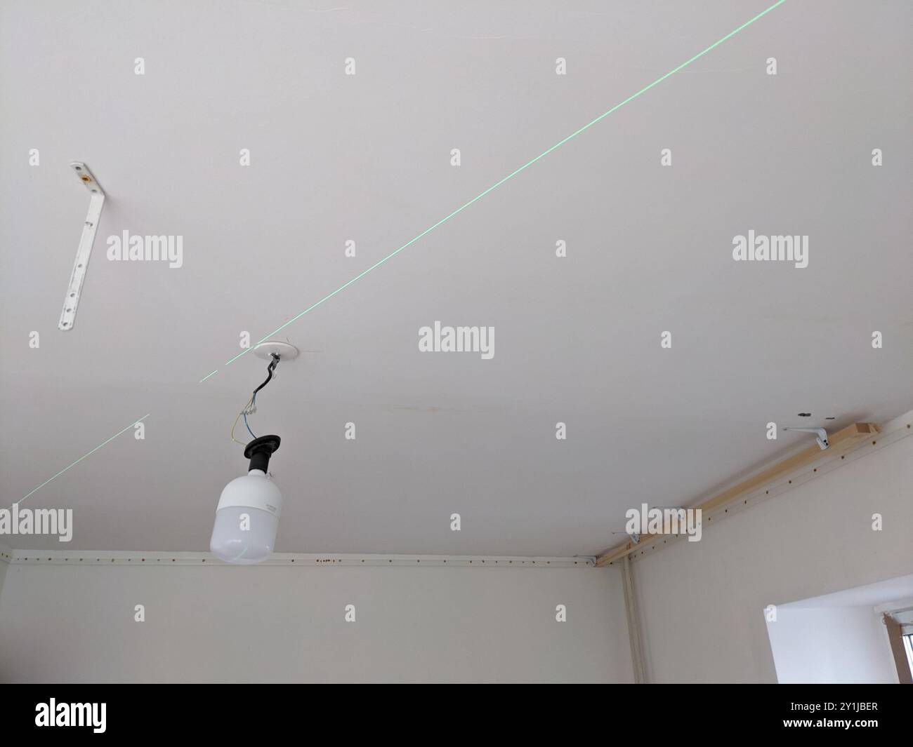 marking on the ceiling. Installation of a stretch ceiling Stock Photo ...