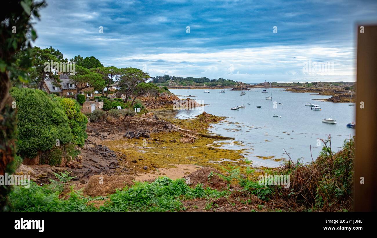 Stone houses overlooking a natural harbour occupied by some small ...