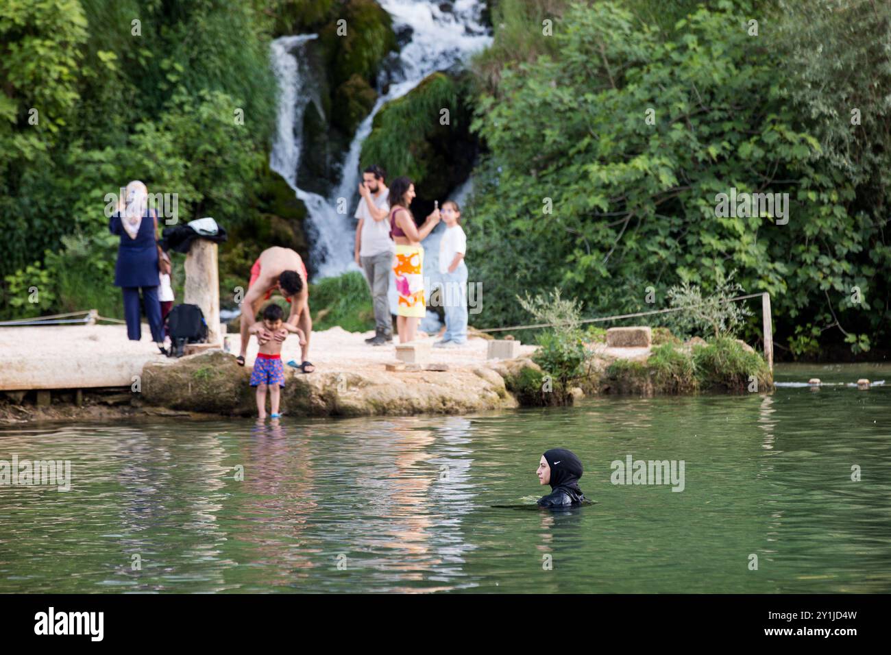A woman in a burqa was seen in the lake at the Kravica waterfalls ...