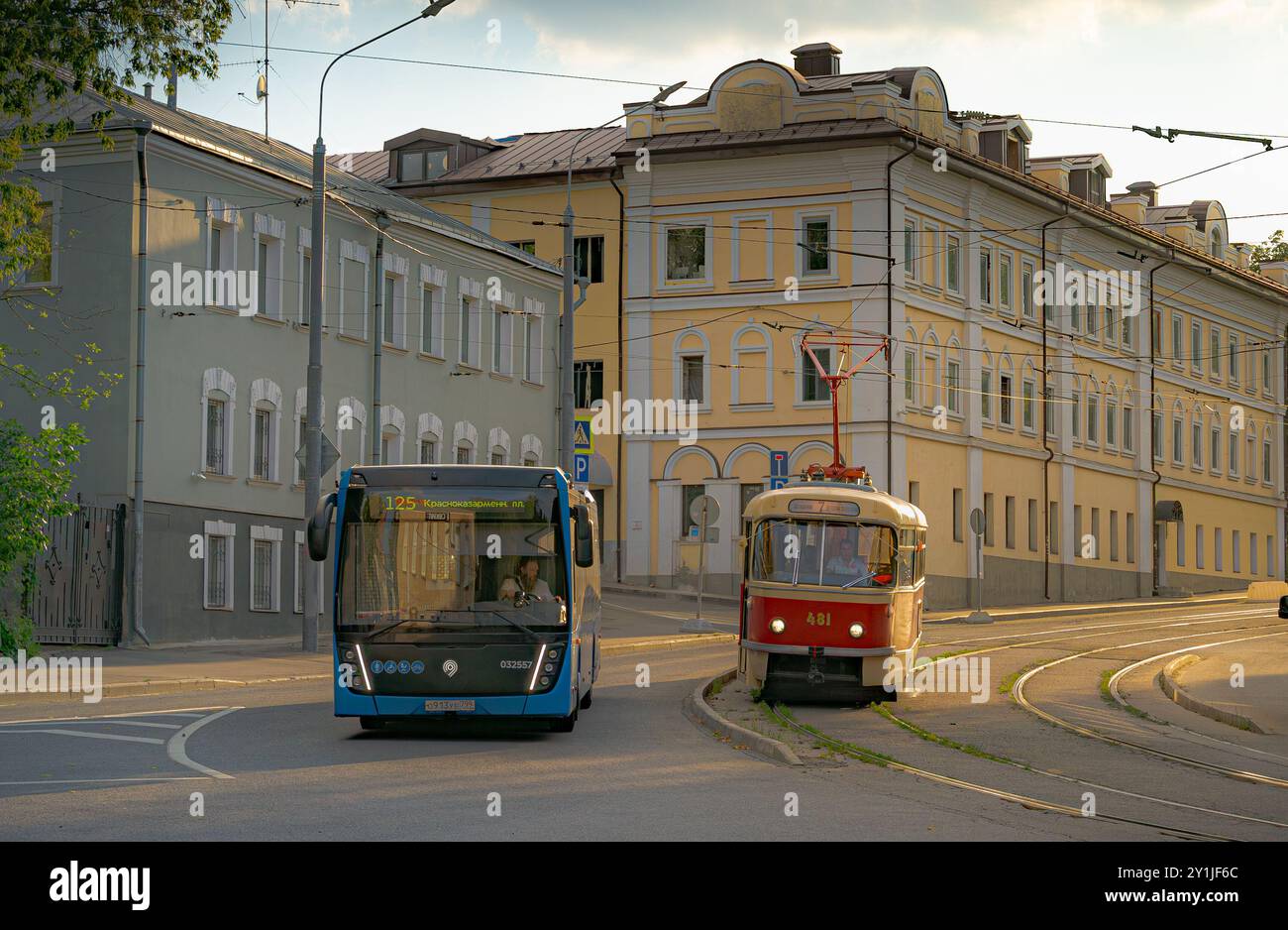 Moscow, Russia - July 13, 2024: Modern bus NefAZ 5299 and vintage tram ...