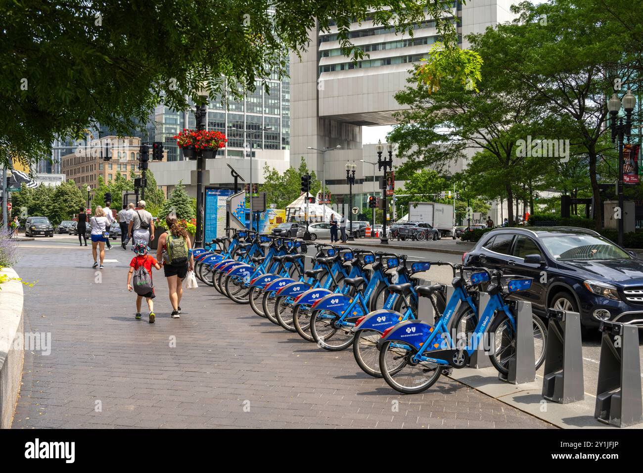 Side view on a row of Blue Bikes, a dock based bicycle sharing network ...