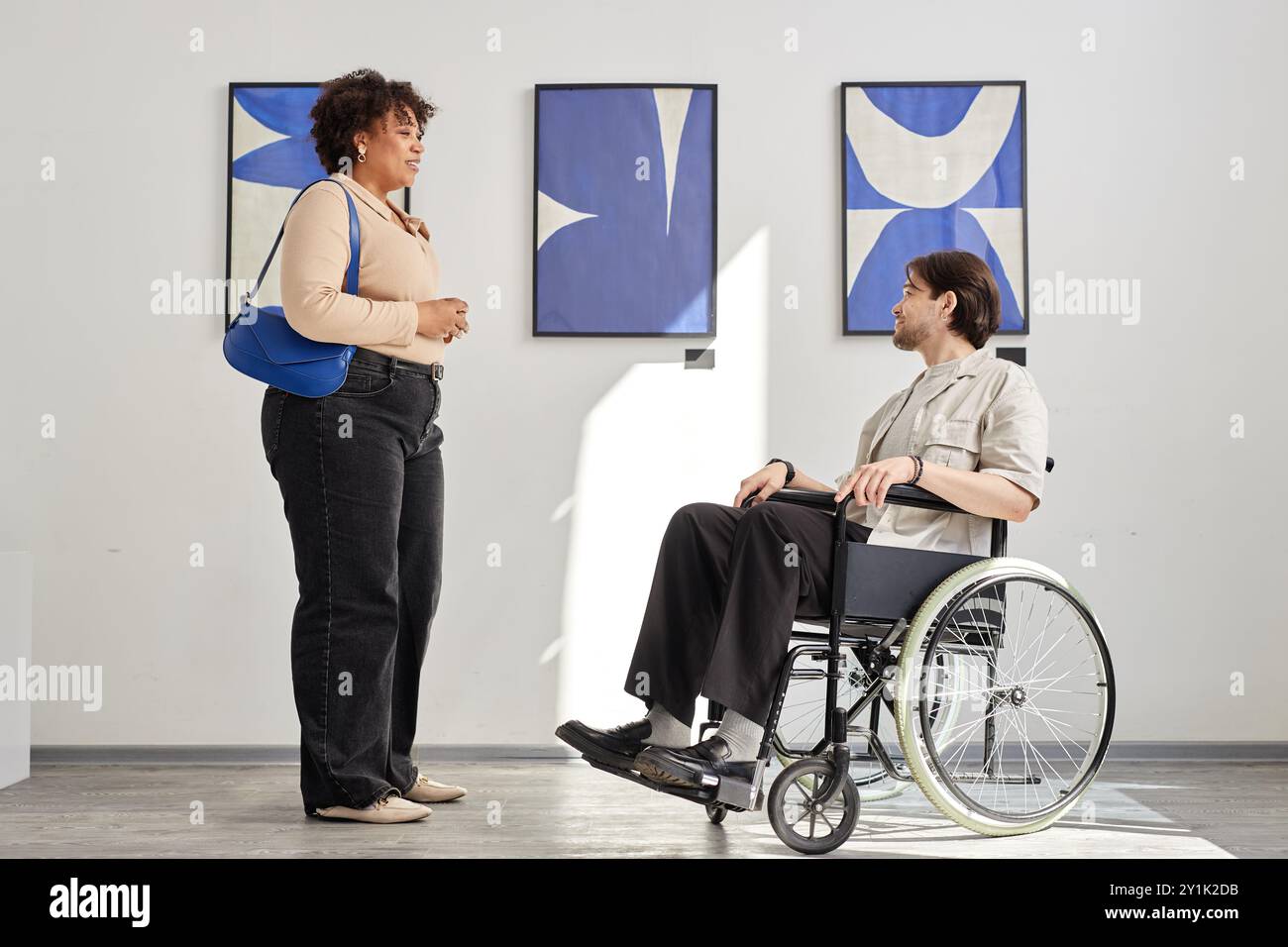 Minimal side view shot of man with disability using wheelchair and ...