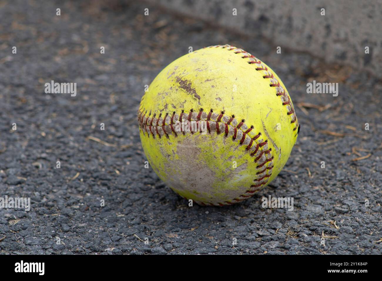 girls fastpitch yellow softball with red seams Stock Photo - Alamy