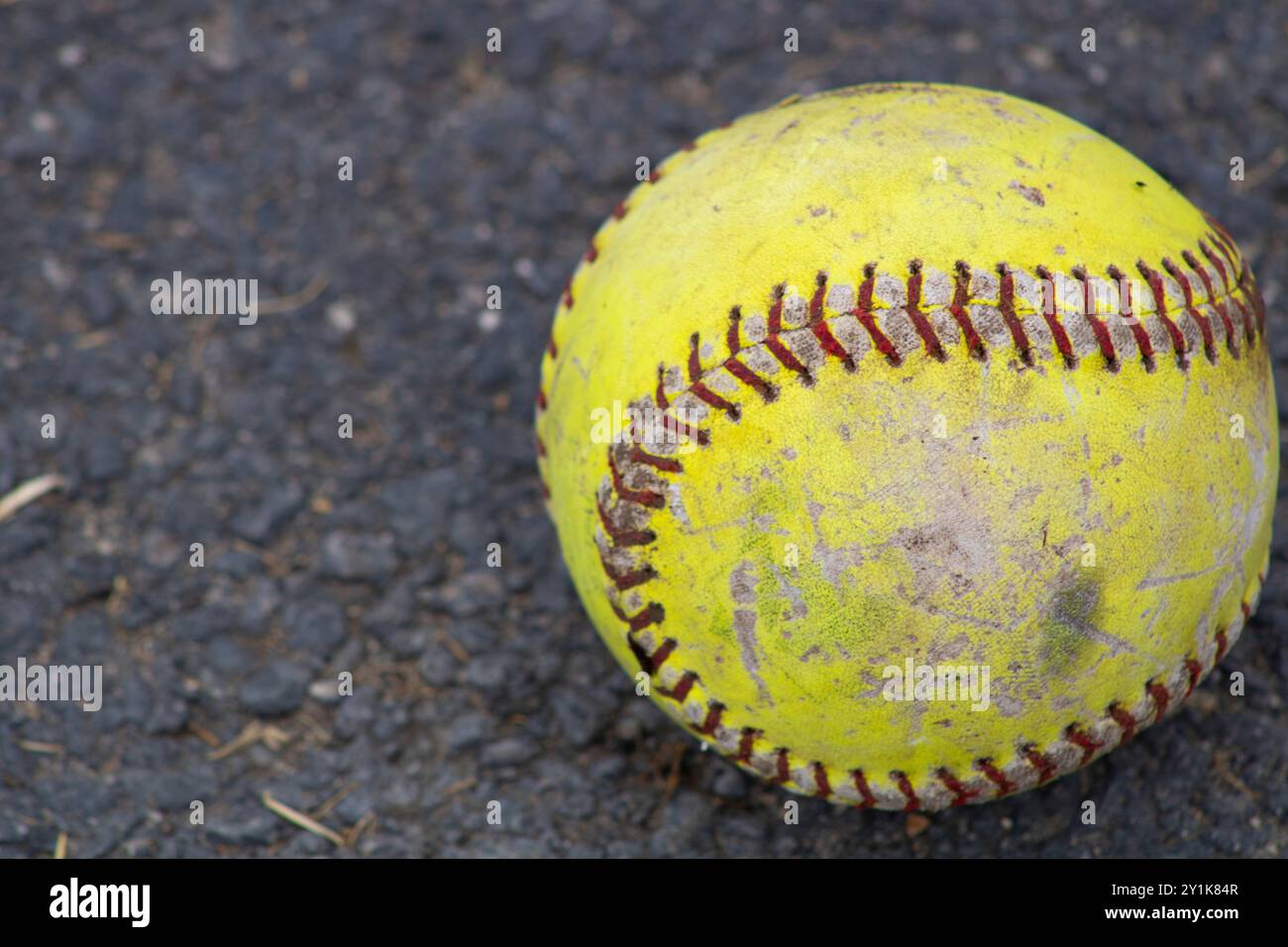 girls fastpitch yellow softball with red seams Stock Photo - Alamy