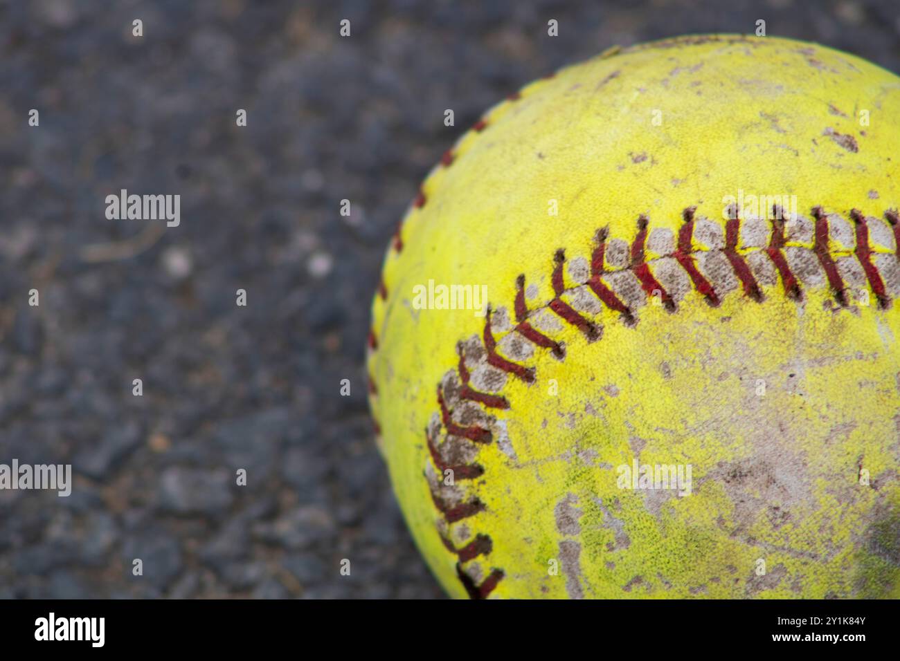 girls fastpitch yellow softball with red seams Stock Photo - Alamy