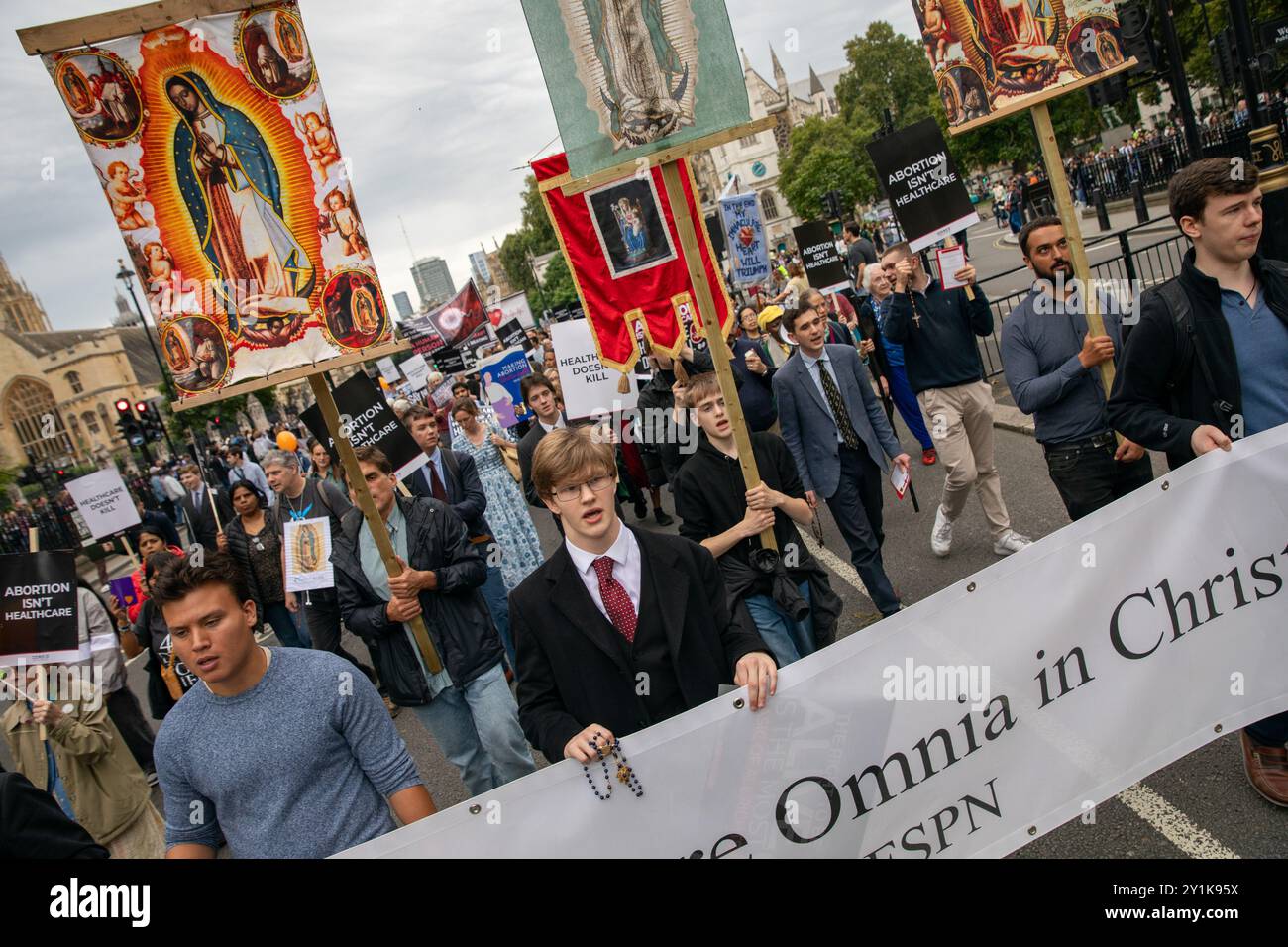Religious pro-life demonstrators carry banners and placards during the ...