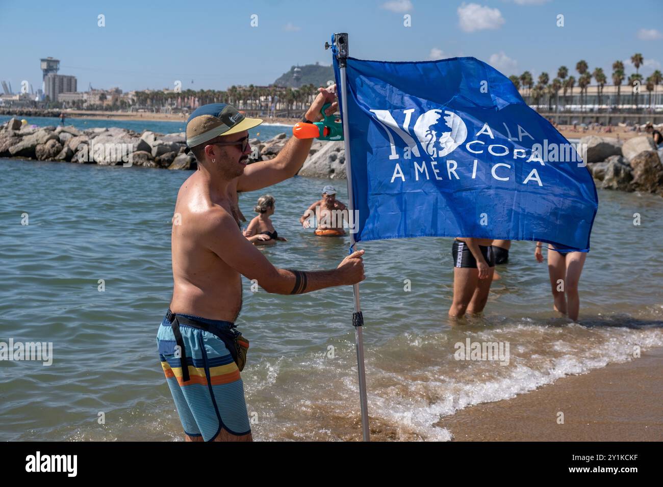Barcelona, Spain. 7th Sep 2024. A protester is seen fixing a flag in ...