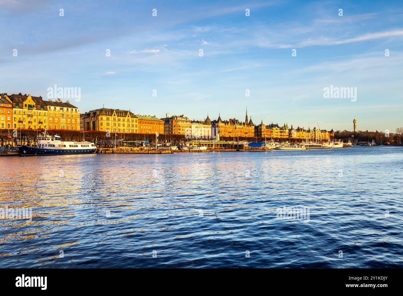 View of historic buildings along Nybroviken at sunset, Stockholm ...