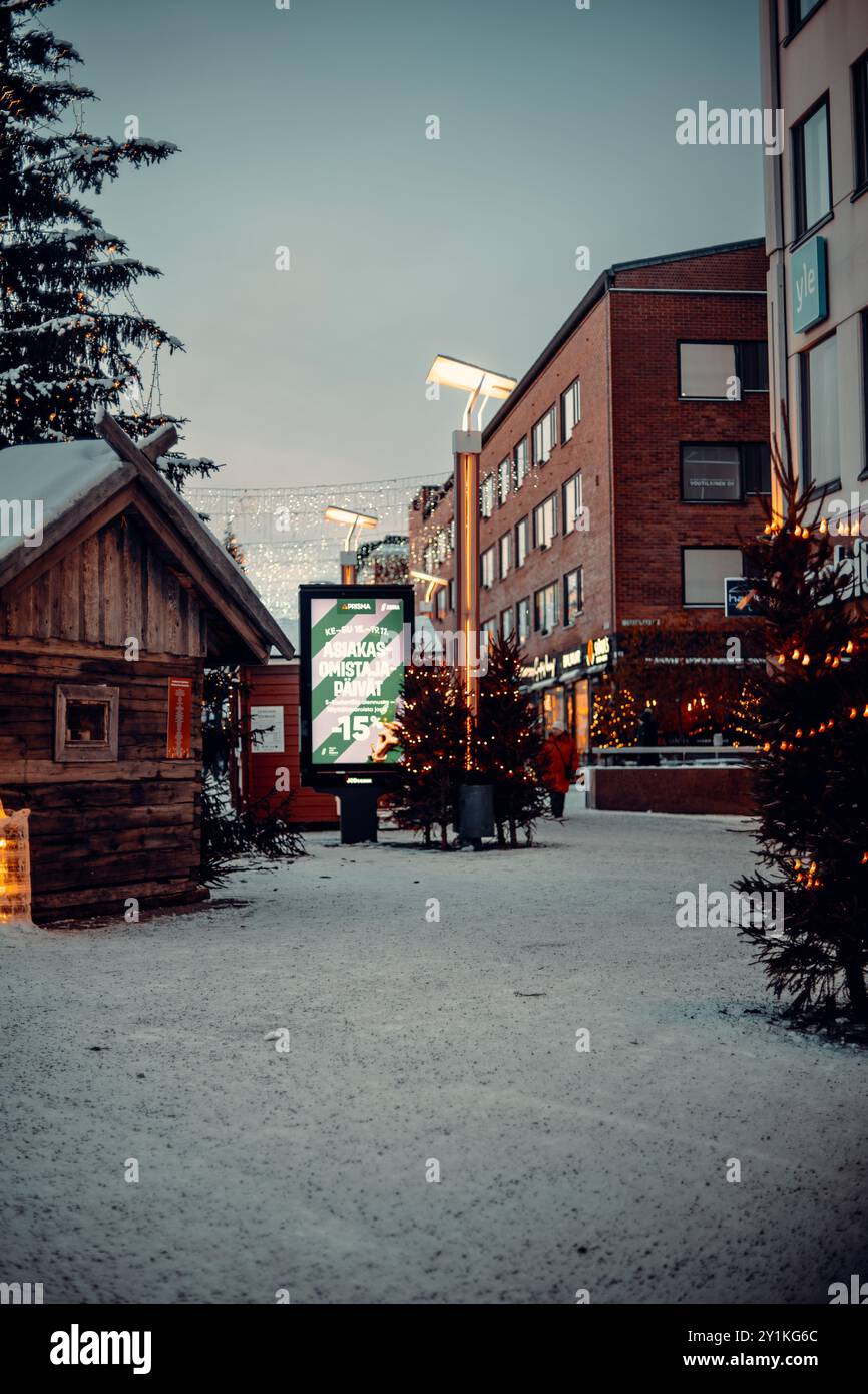 Billboard adverts next to Christmas trees in Rovaniemi, Lapland in ...