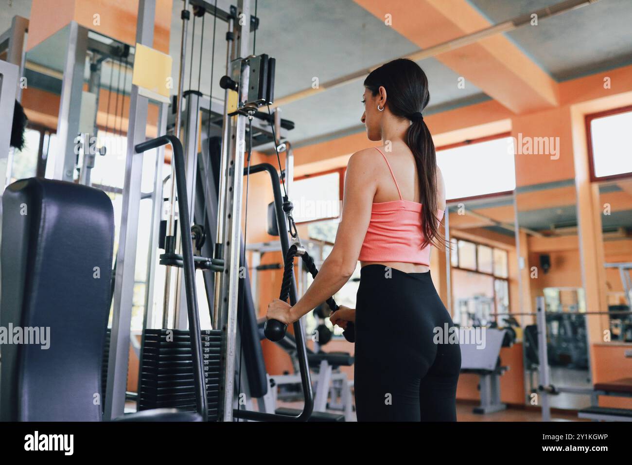 Woman Doing Triceps Pull Down Exercices Stock Photo - Alamy