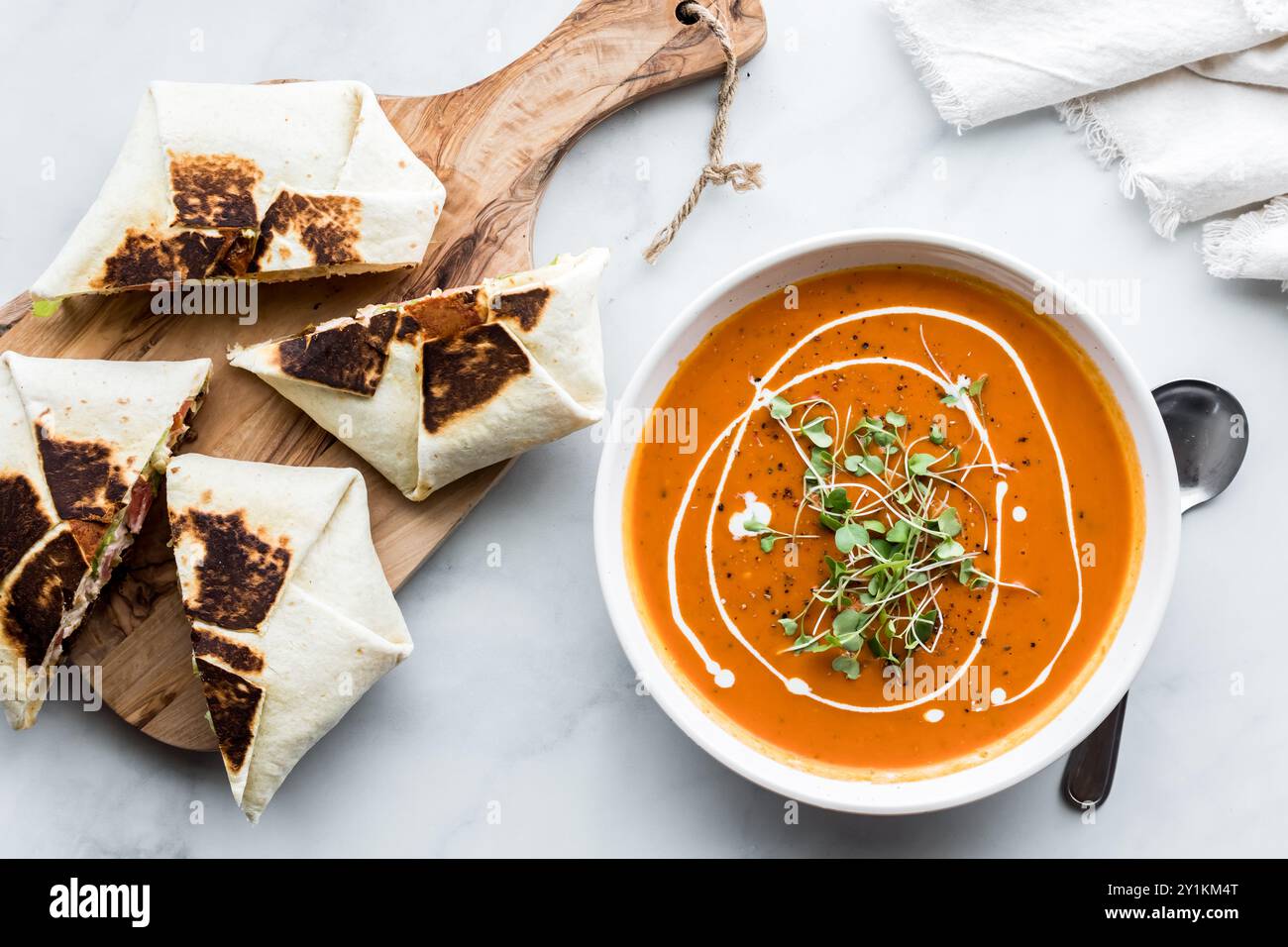 Homemade roasted red pepper soup served with crunch wraps Stock Photo ...