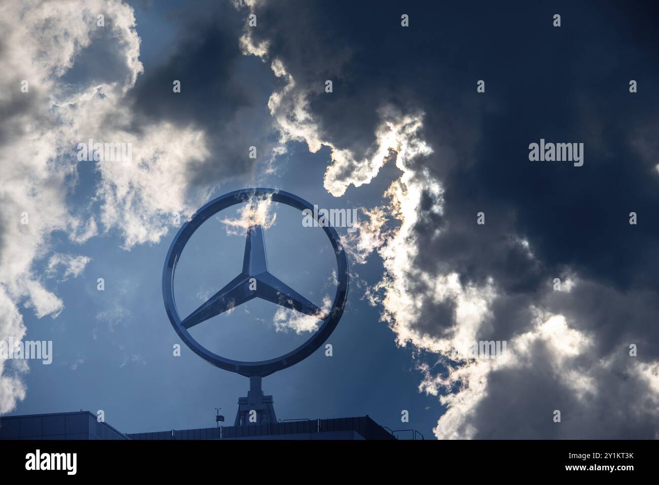 Symbolic image, Dark clouds at Mercedes, Mercedes logo on a building ...