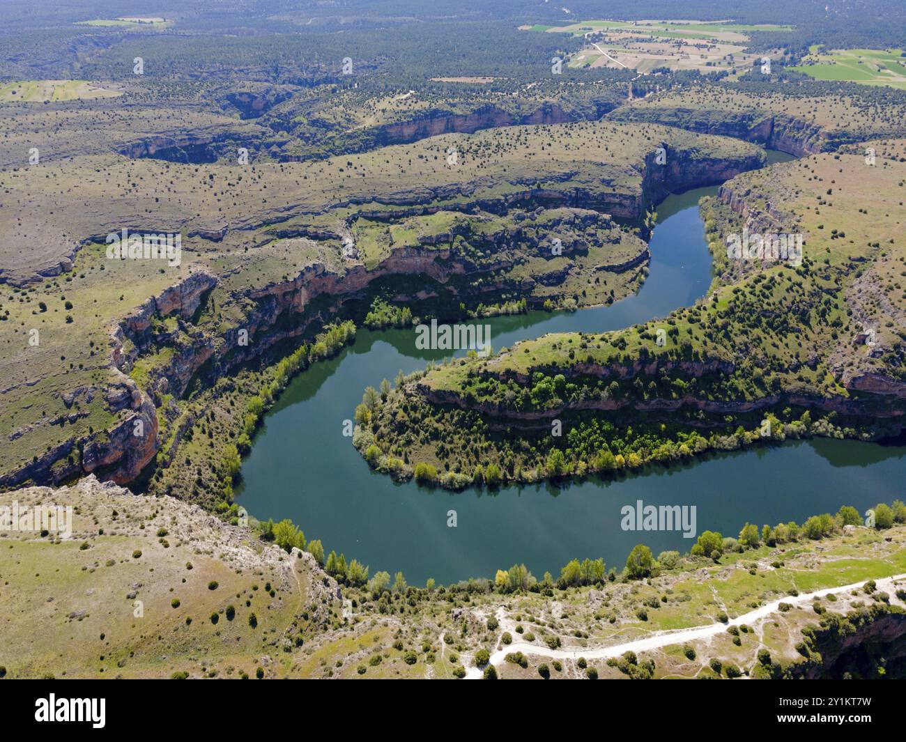 Expansive view of a river winding through deep gorges and hilly ...