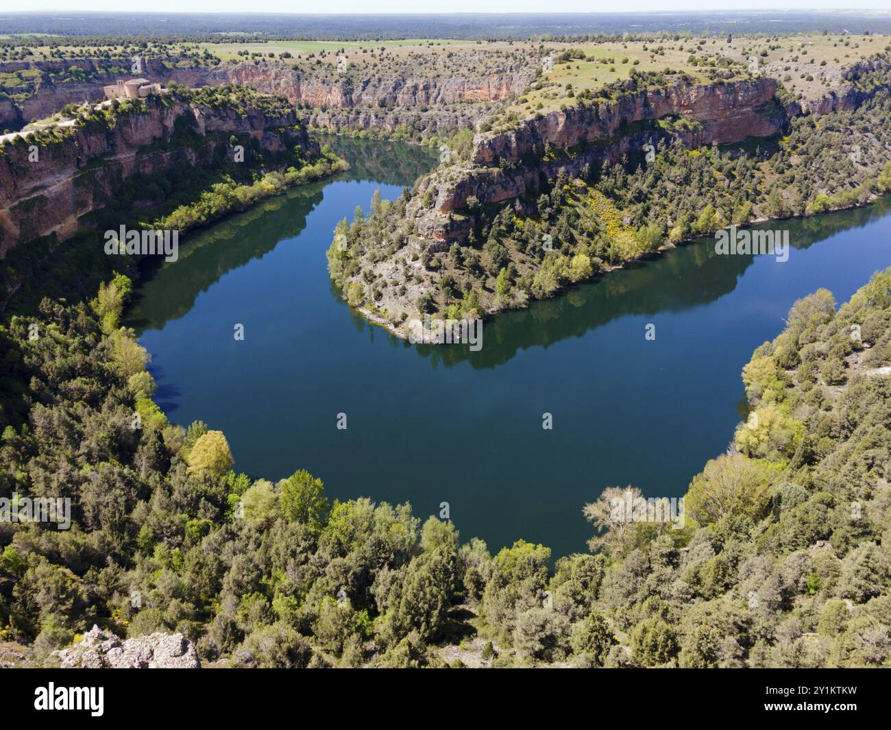 Expansive view of a river winding through deep gorges and a mountainous ...