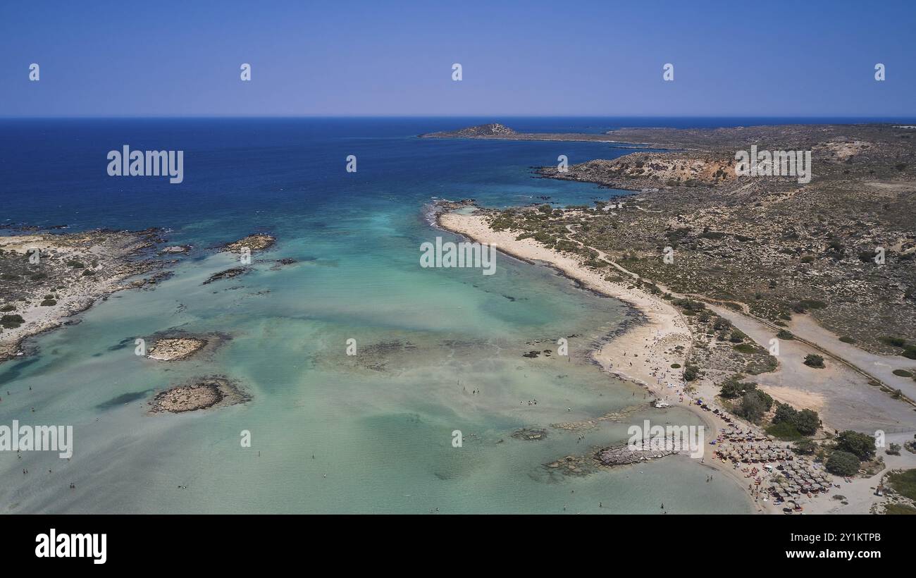 Overtourism, tourists on the beach, parasols, coastal landscape with ...