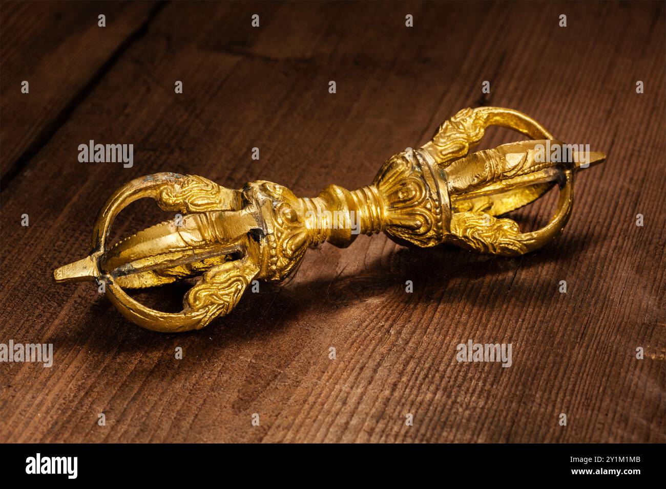 Tibetan Buddhist Dorje vajra ceremonial item on wooden background Stock ...