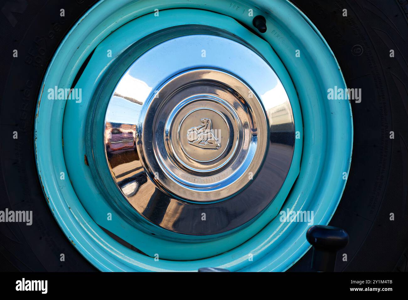 A classic antique rim and tire on a trailer outside Stock Photo - Alamy