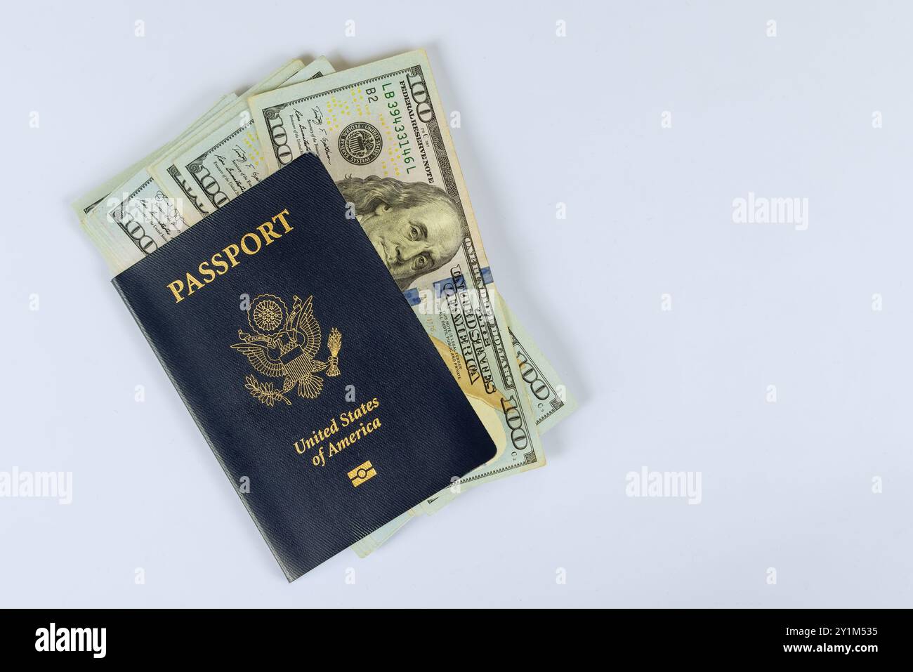 American passport on top of American dollar cash banknotes Stock Photo ...