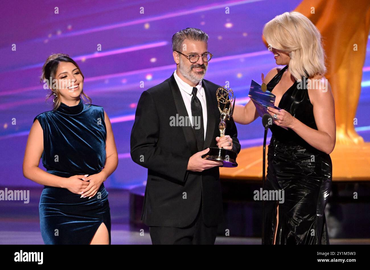 Hannah Waddingham, right, presents Dave Roth with the Emmy for ...