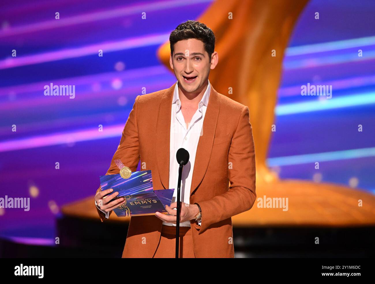 Matt Friend presents the Emmy for outstanding narrator during night one ...