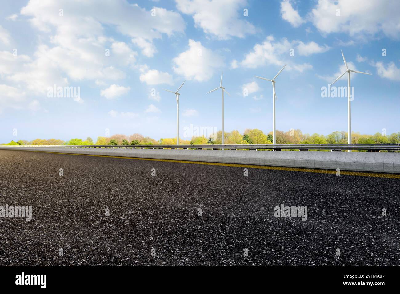 3d rendering empty cement road with wind turbines for green energy ...