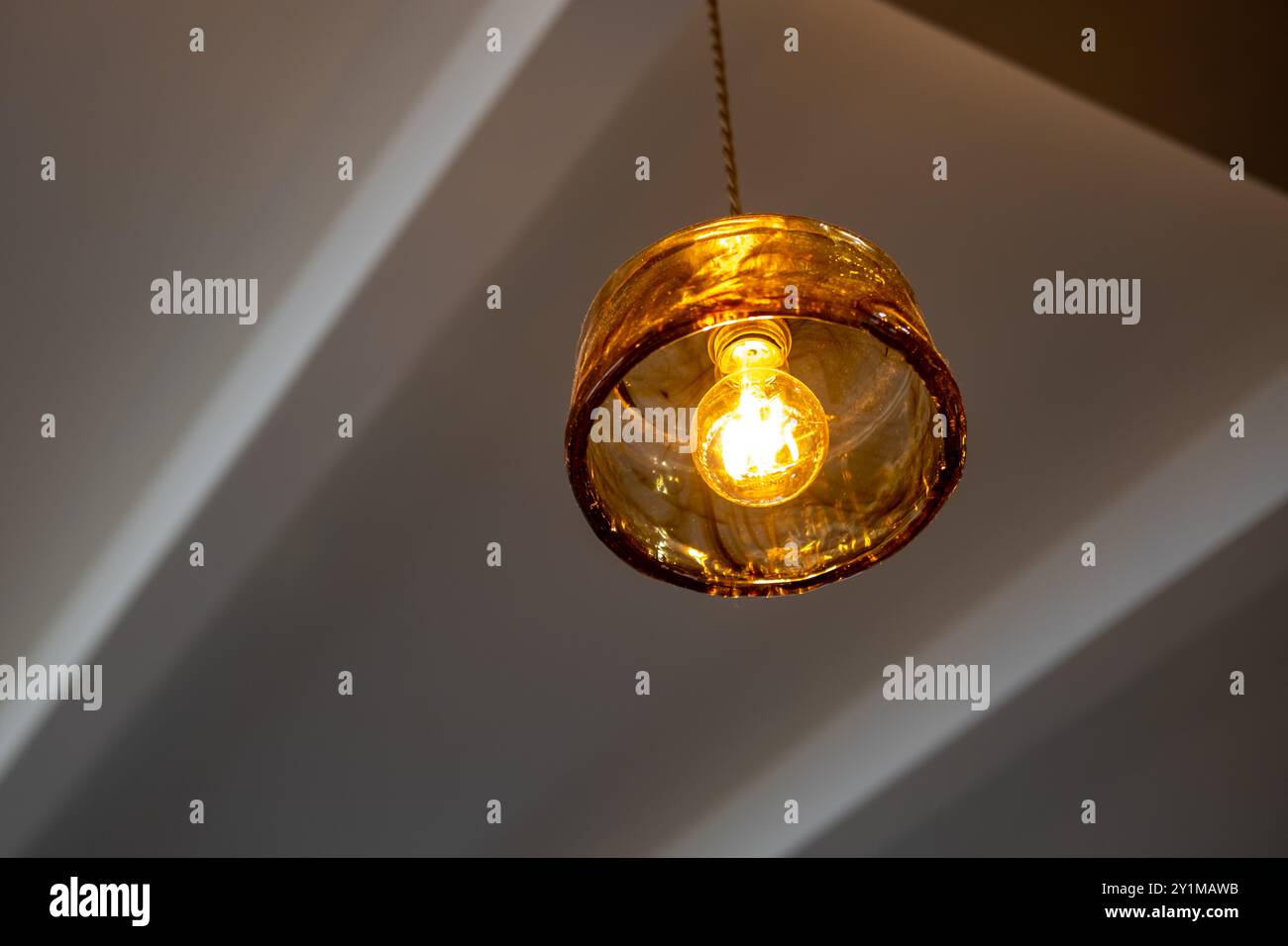 Hanging Edison light bulb, also known as filament light bulb. with ...