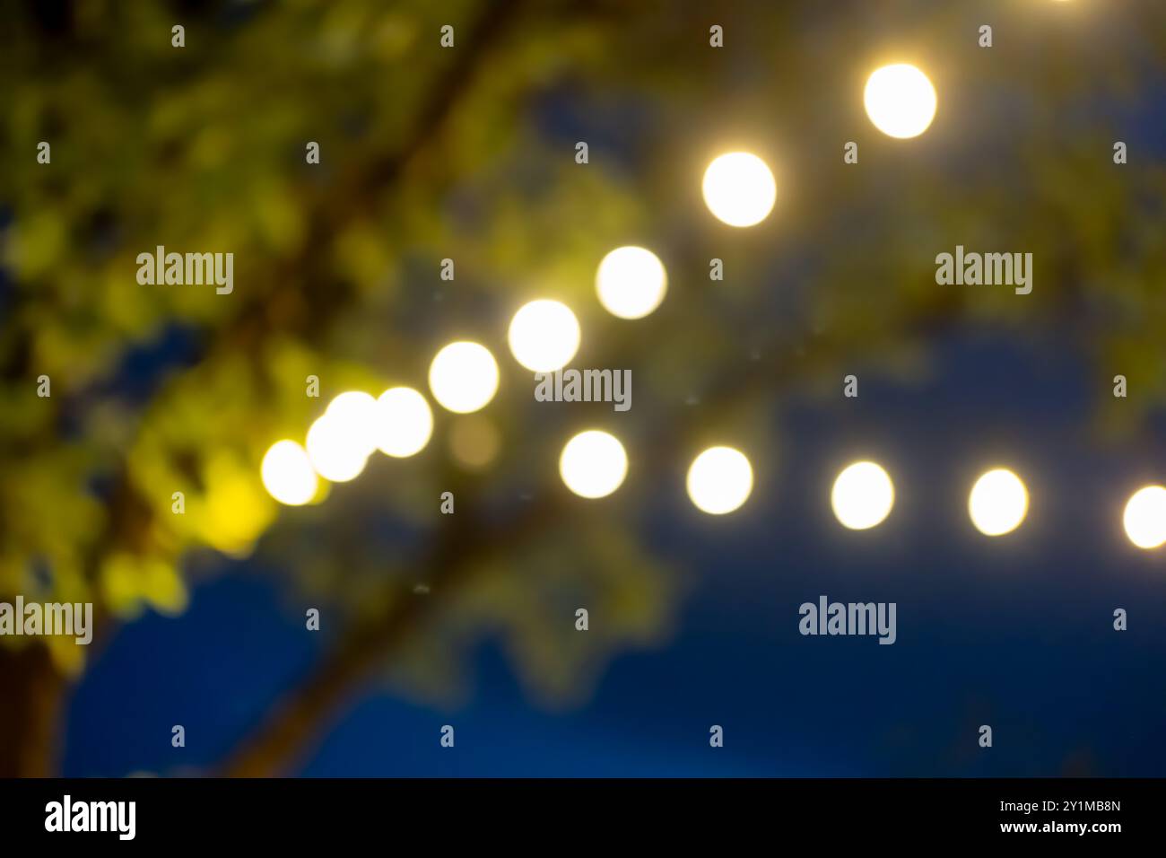 Blurred image bokeh of string light, lighting for the outdoor ...