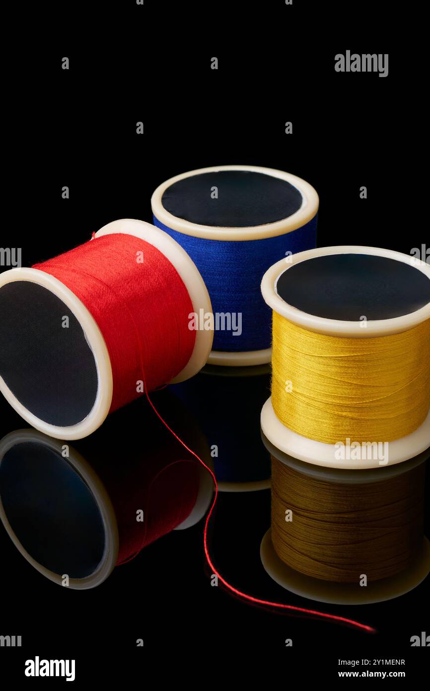 primary colors of spools of cotton embroidery sewing thread isolated ...