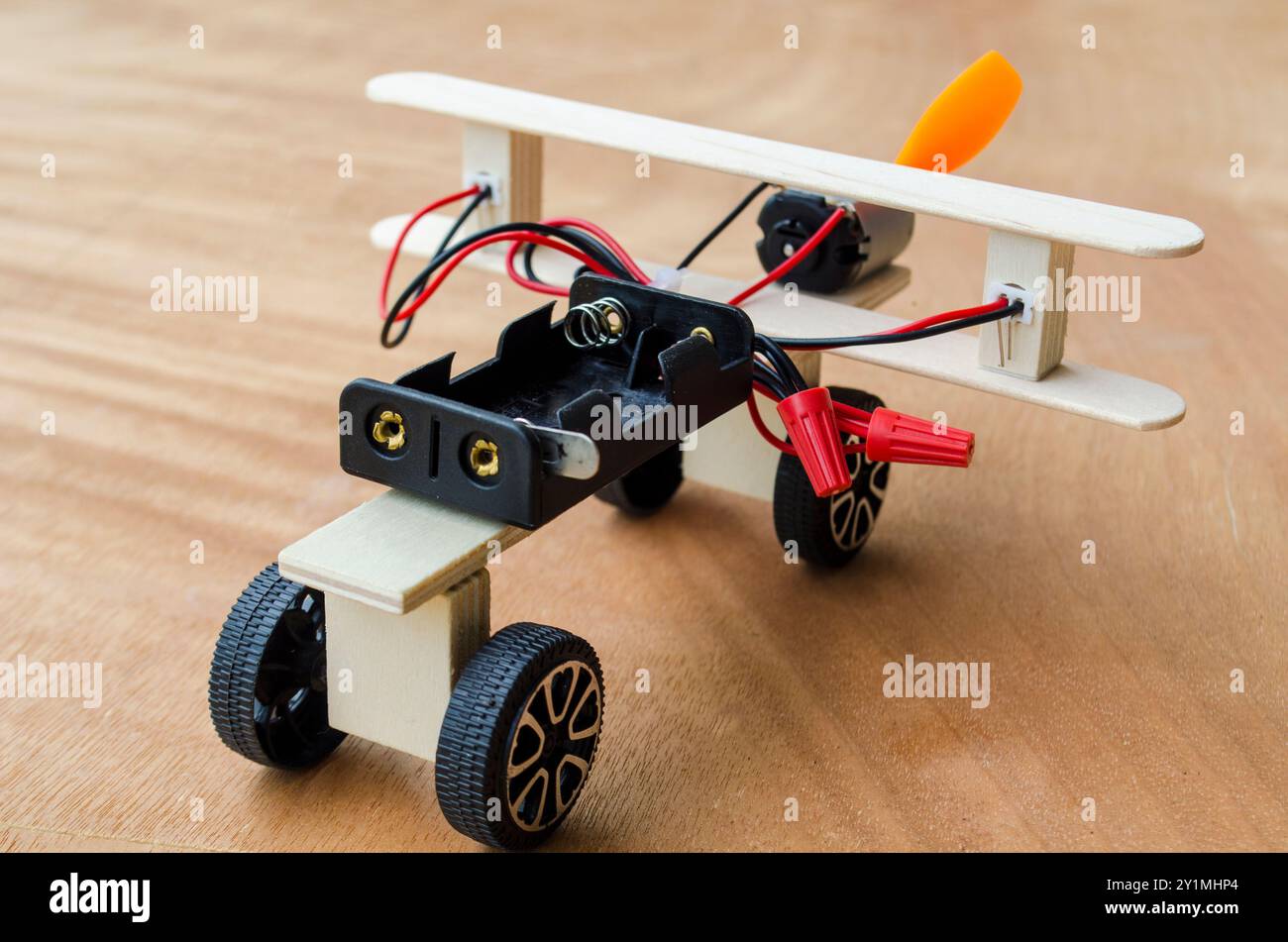 Back view of Do It Yourself toy airplane made by wooden sticks and DC ...