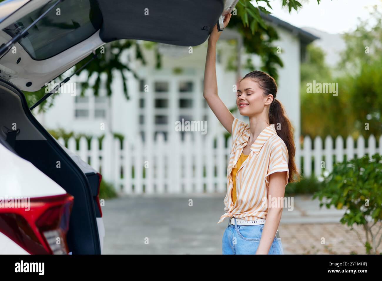 woman, car, trunk, smiling, happiness, outdoor, house background ...