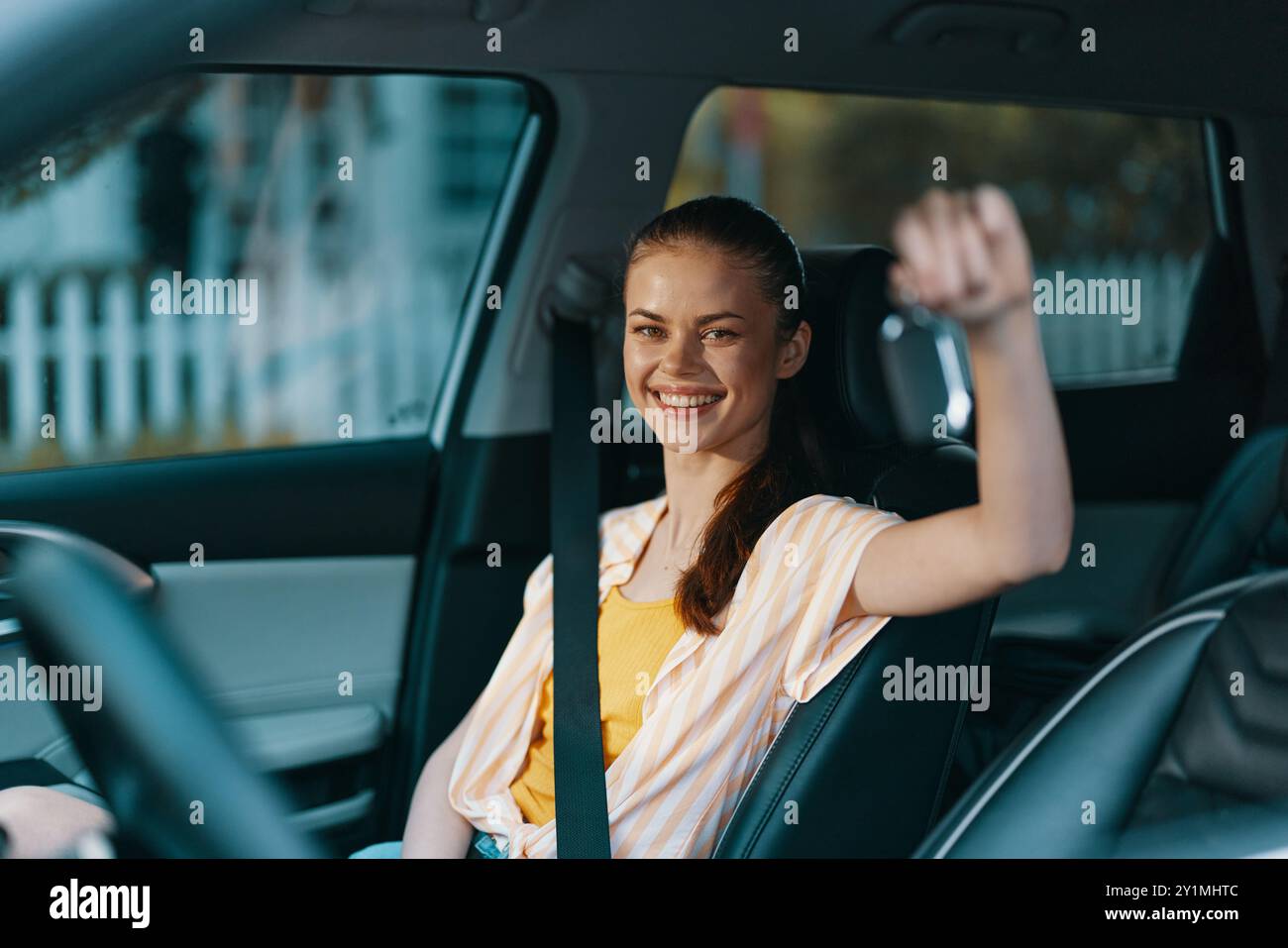 happy woman in car, smiling, driving, joy, freedom, lifestyle A young ...