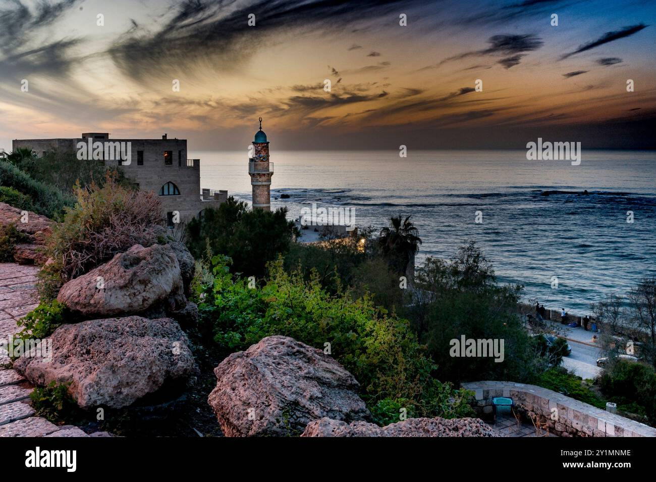 Twilight colors the sky off the coast of Jaffa, Israel with a view of a ...