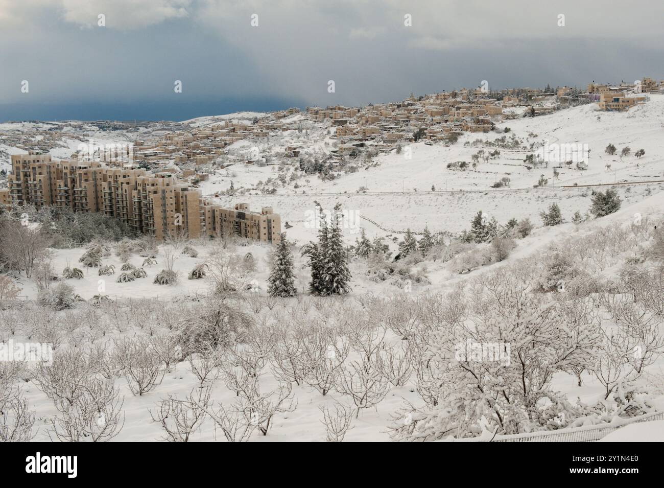 Snow covered hillside of Southern Jerusalem neighborhood of Armon ...