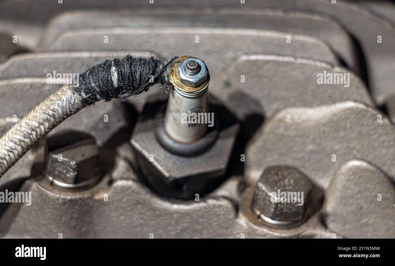Spark plug in motorcycle engine Stock Photo - Alamy