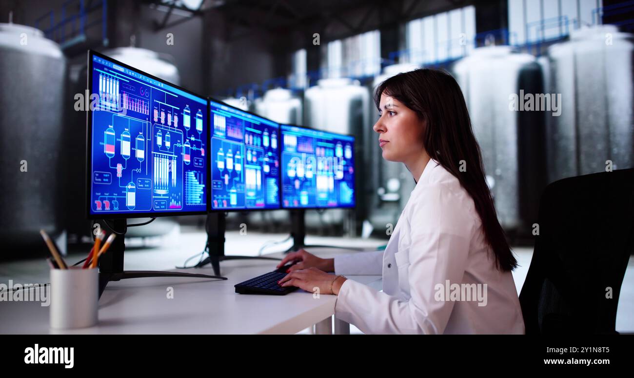 Operators Monitoring Alcohol Production At Wine Production Facility ...