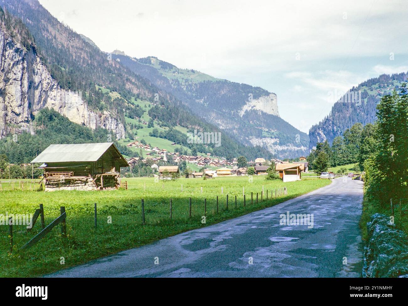 Traditional Swiss buildings in valley floor, village of Lauterbrunnen ...