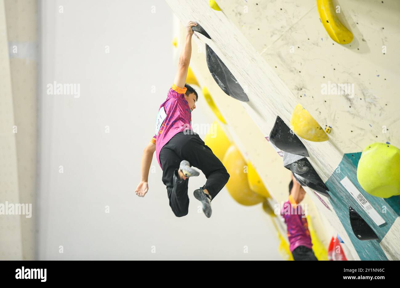 QIANXINAN, CHINA - SEPTEMBER 7, 2024 - Contestants take part in a rock ...