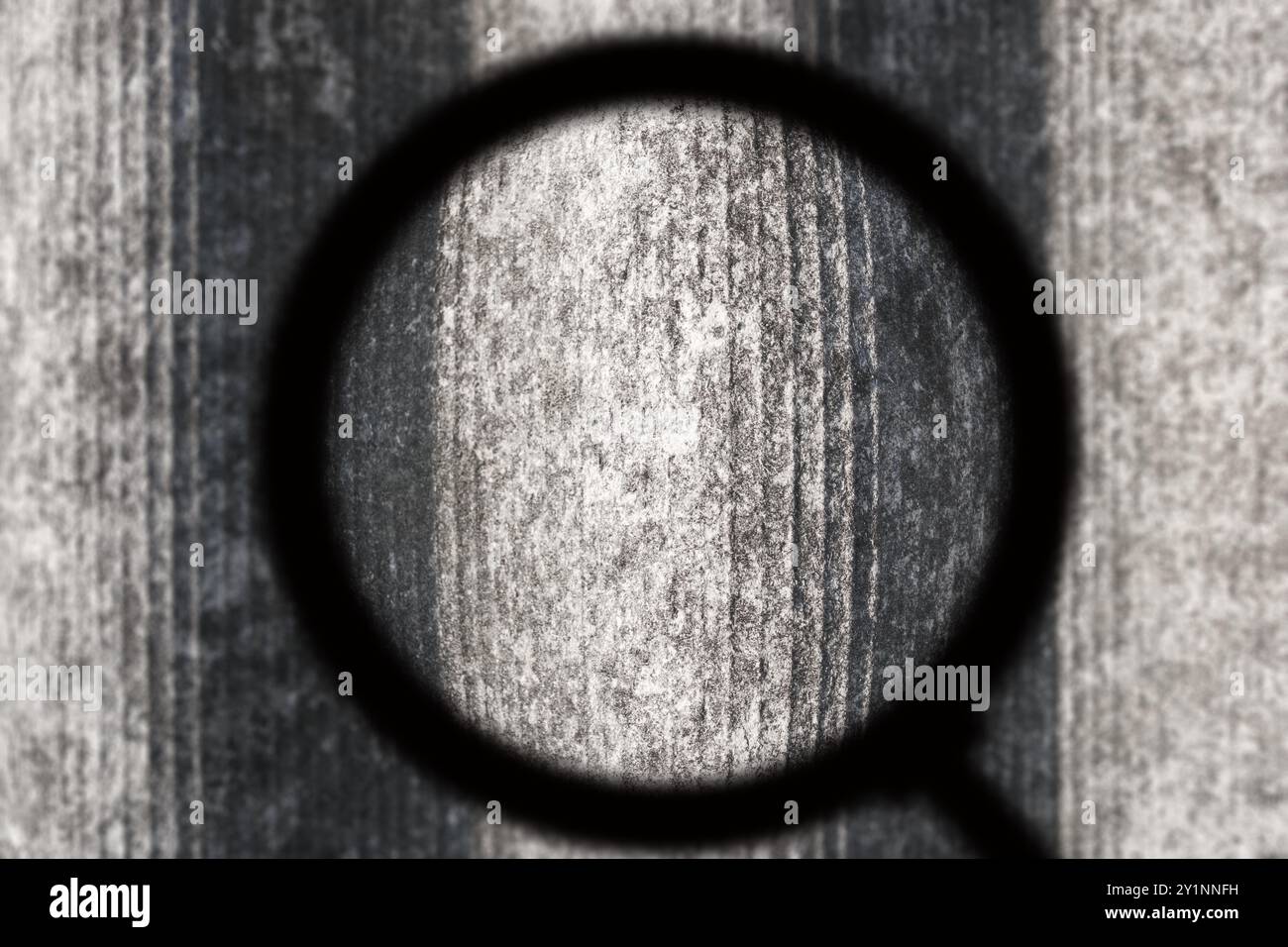 Old and very dangerous asbestos roof. View through magnifying glass ...