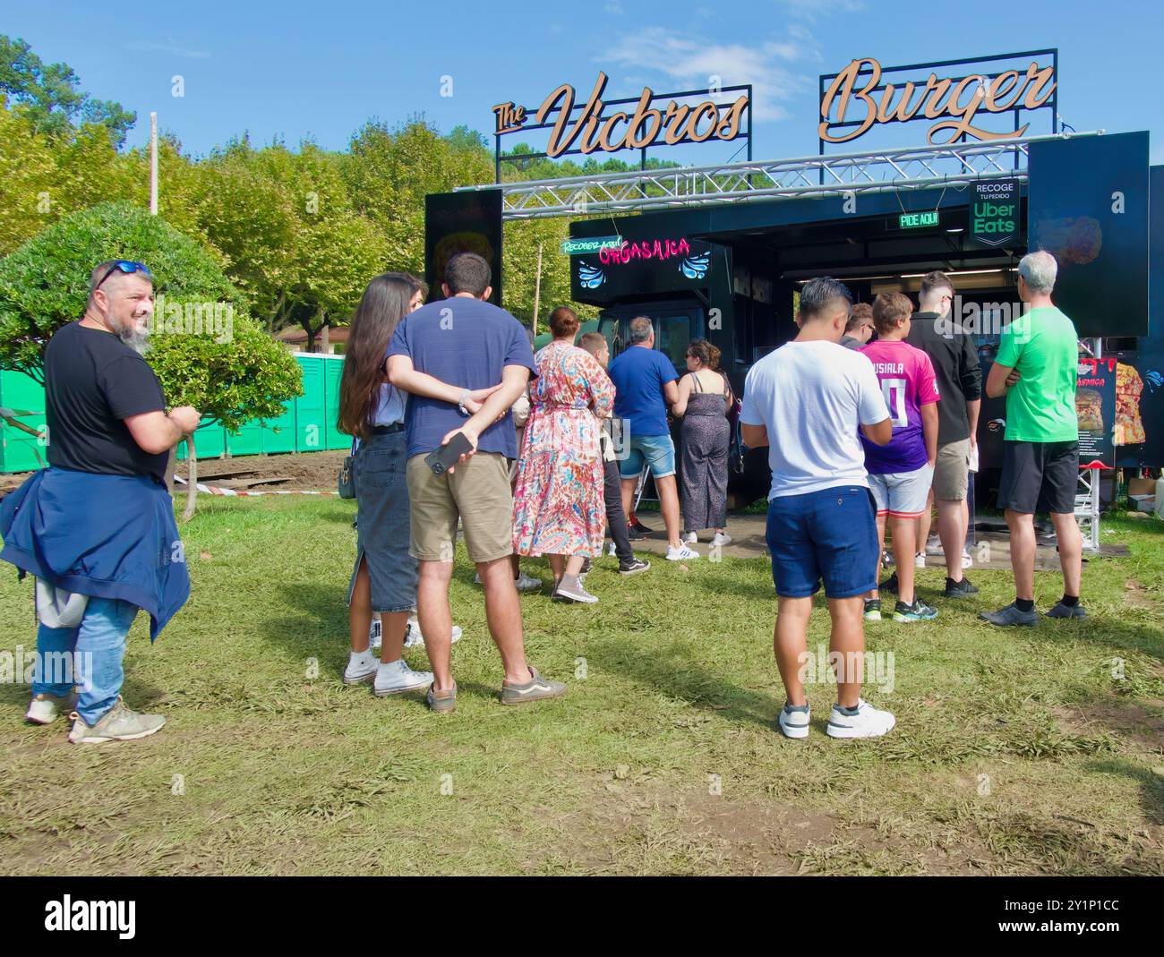 People queueing at the The Vicbros Burger food truck The Champions ...