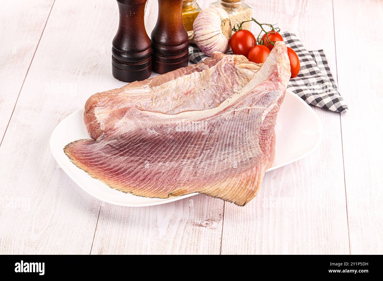 Raw uncooked stingray fish wing in thw plate Stock Photo - Alamy