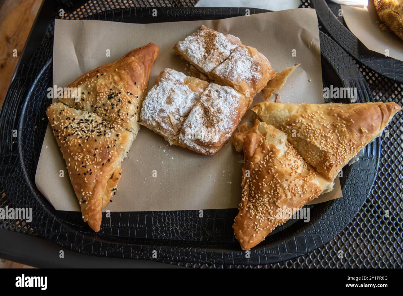 Plate of traditional spanakopita, bougatsa and tiropita pies in Rhodes ...