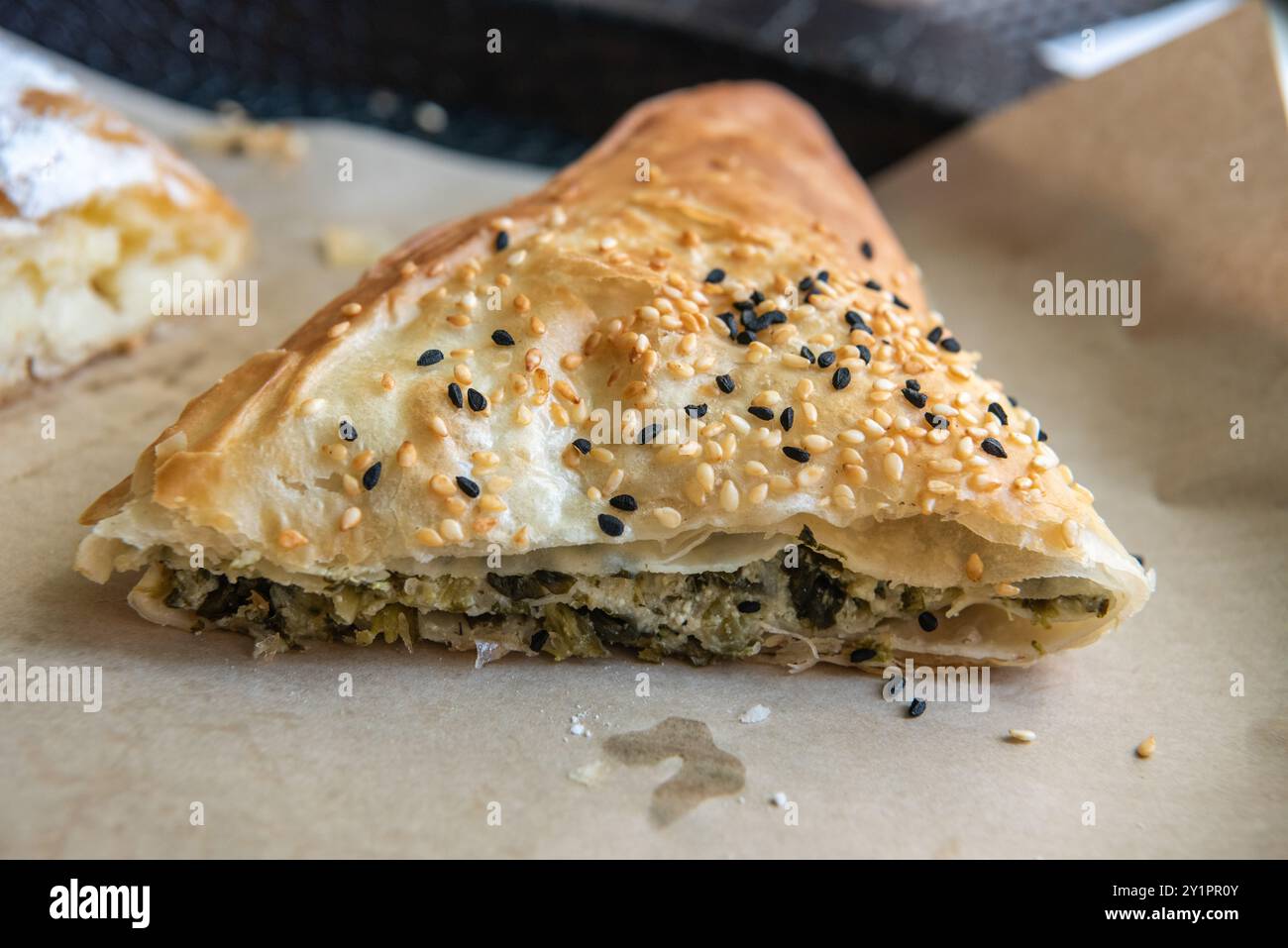 Traditional spanakopita spinach pie in Rhodes, Greece. Spanakopita is a ...