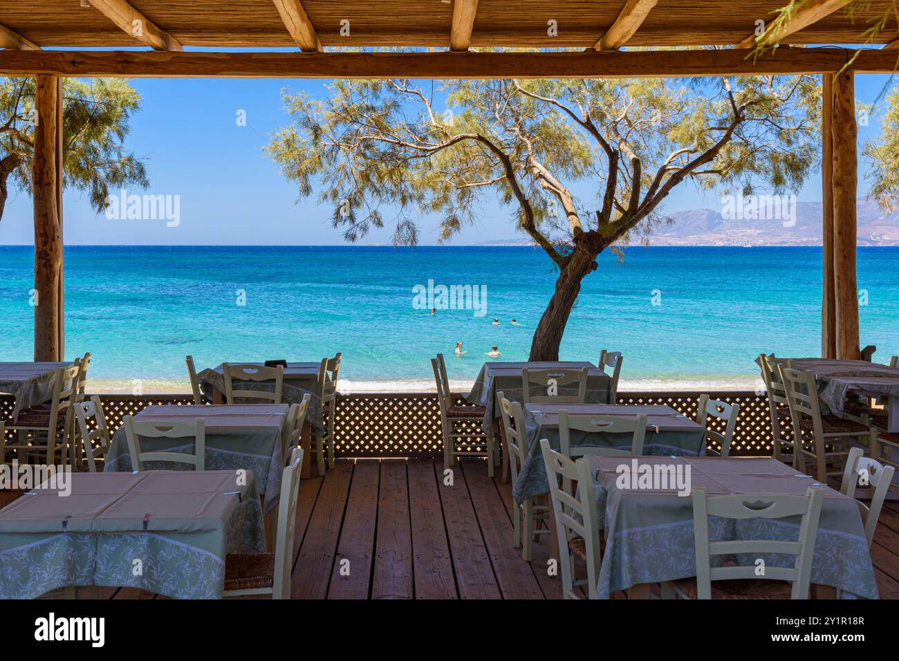 Views of the beach through an open air restaurant at Maragas Beach ...