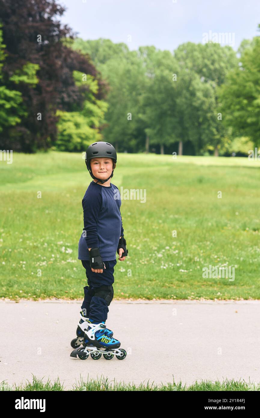 Active little boy skating in summer park, healthy lifestyle for ...