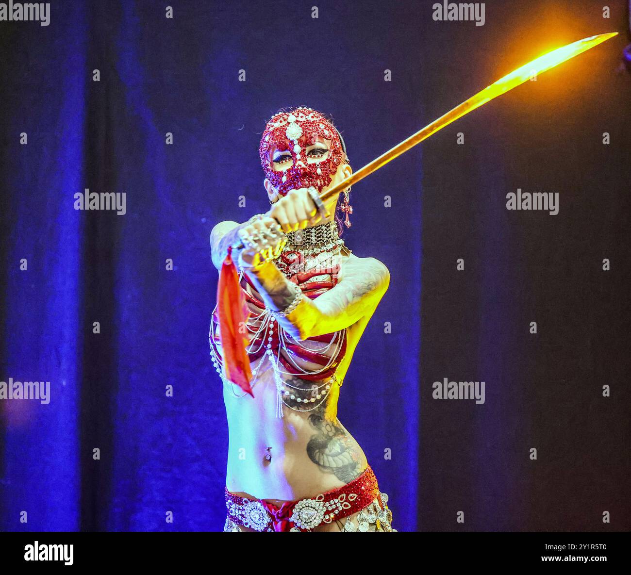 Girl with masks tattoos and sword hi-res stock photography and images ...