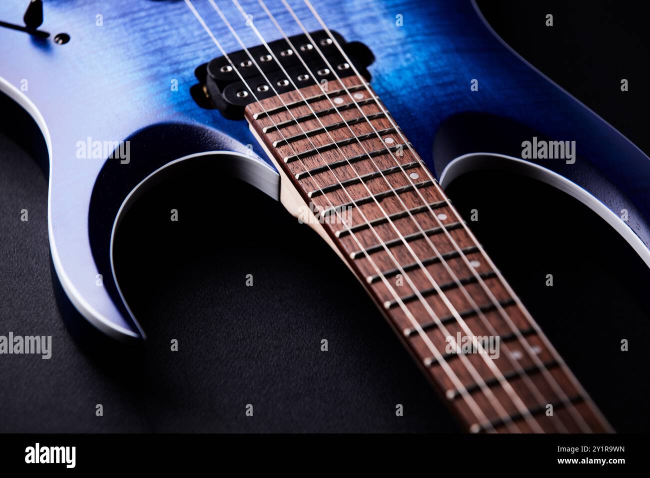 Fretboard of modern electric guitar. Close up Stock Photo - Alamy