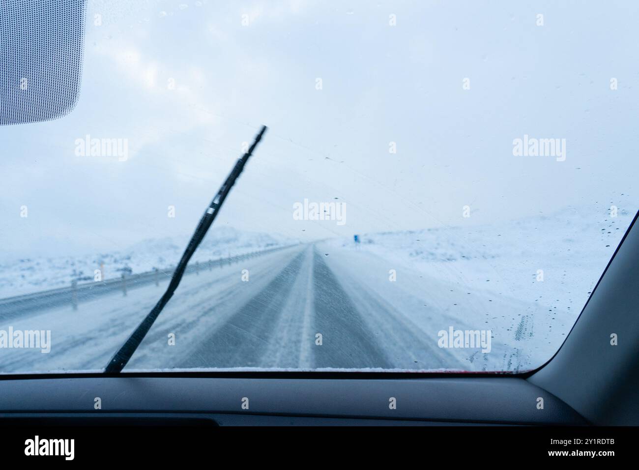 Road with temporary snow in winter seen from inside a car a car Stock ...